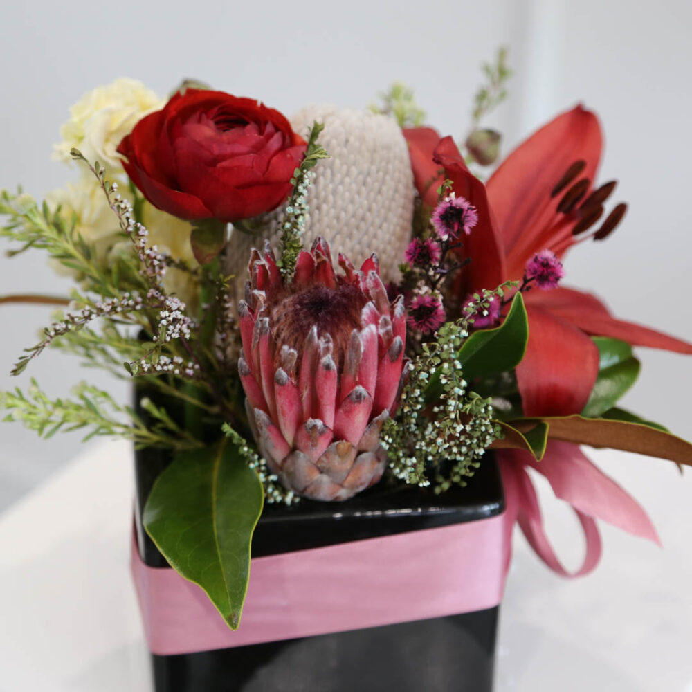 Natives in a Ceramic Vase with Mixed Flowers - Kat Flowers & Events